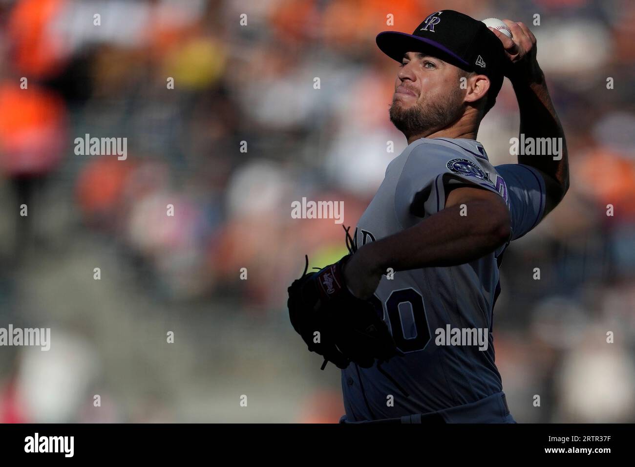 Colorado Rockies pitcher Peter Lambert throws a warm up pitch before a ...