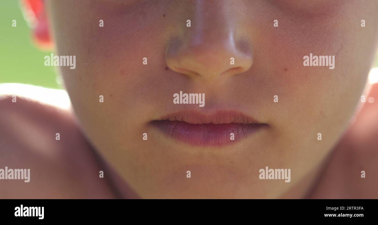 Child lips close-up changing emotions, kid changes mood from happy to ...