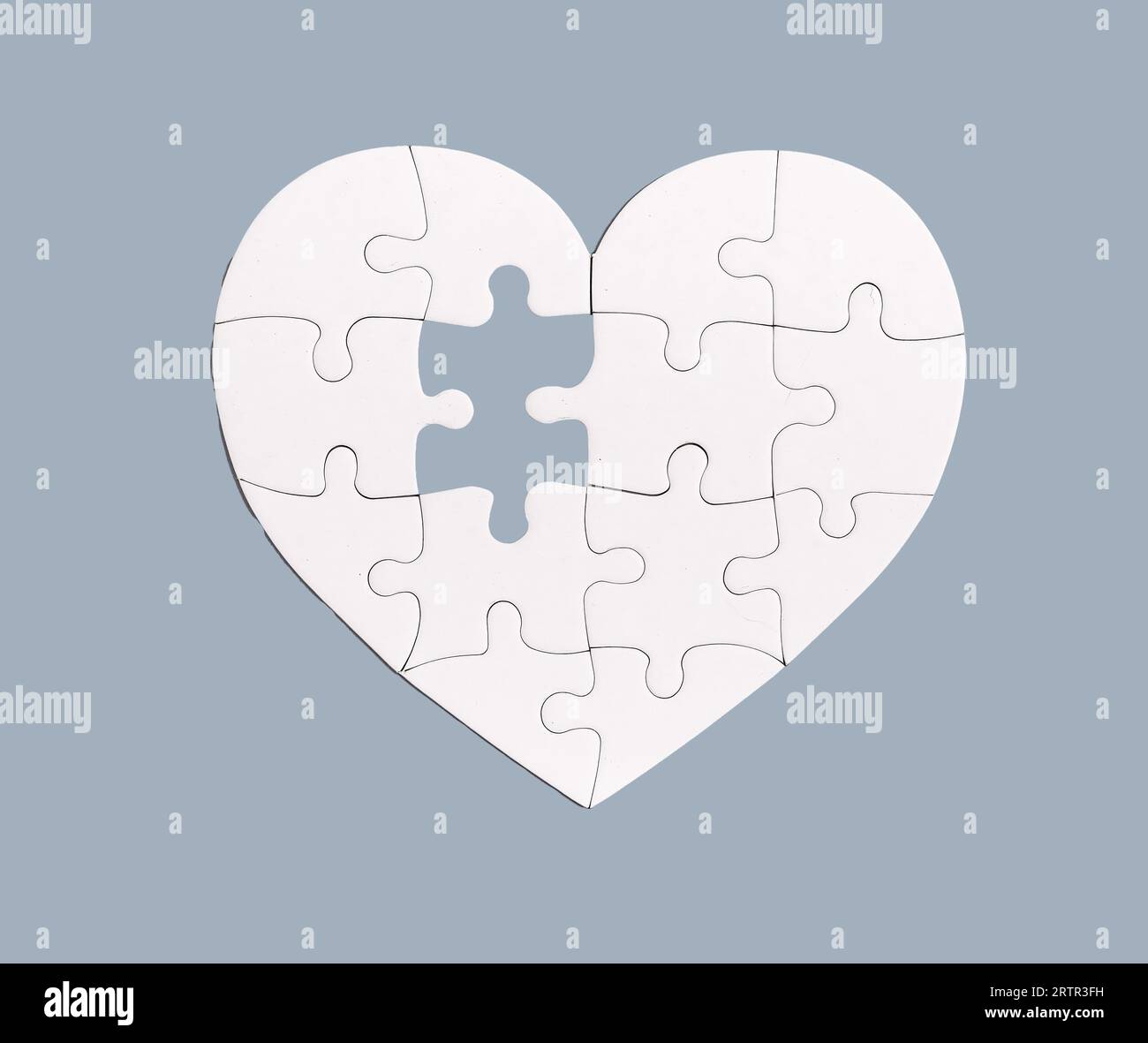 Lacking missing puzzle piece, element in heart jigsaw Stock Photo - Alamy