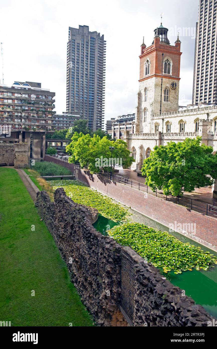 View of London Wall & moat, St Giles church, Barbican towers tall high ...