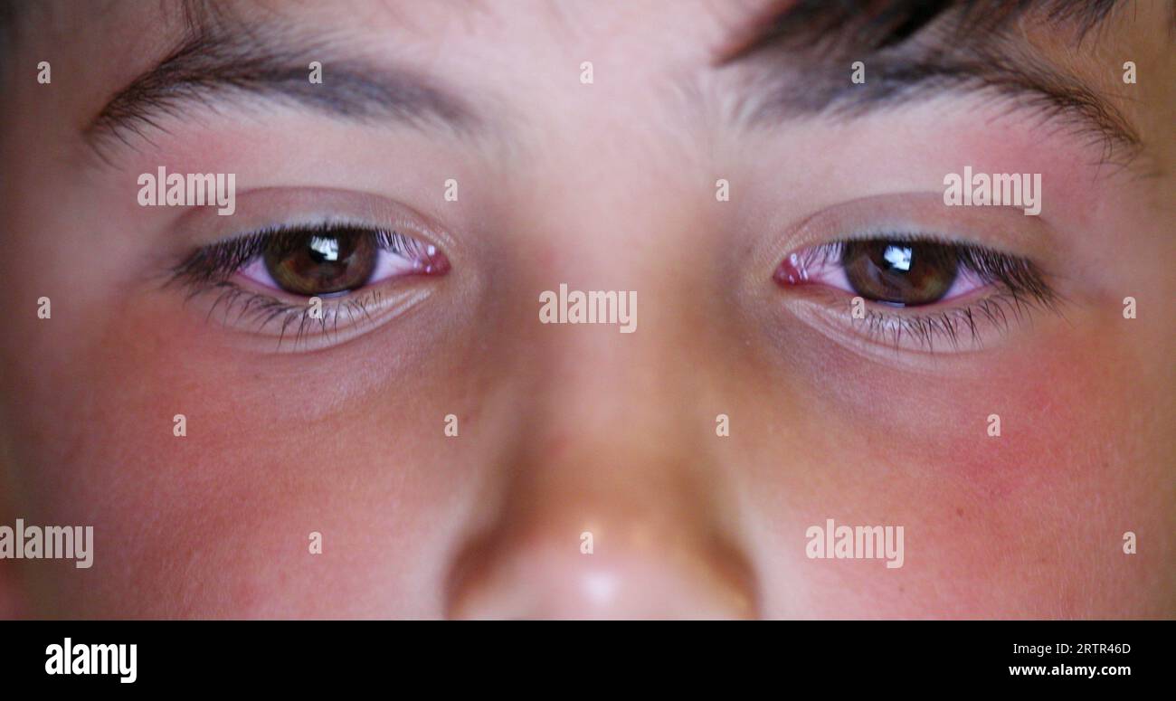 Child boy eyes looking at tablet device screen. Kid staring at blue ...
