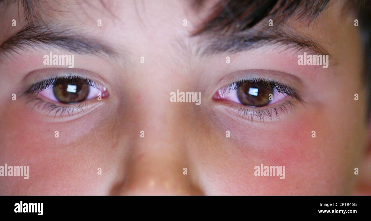 Child boy eyes looking at tablet device screen. Kid staring at blue ...