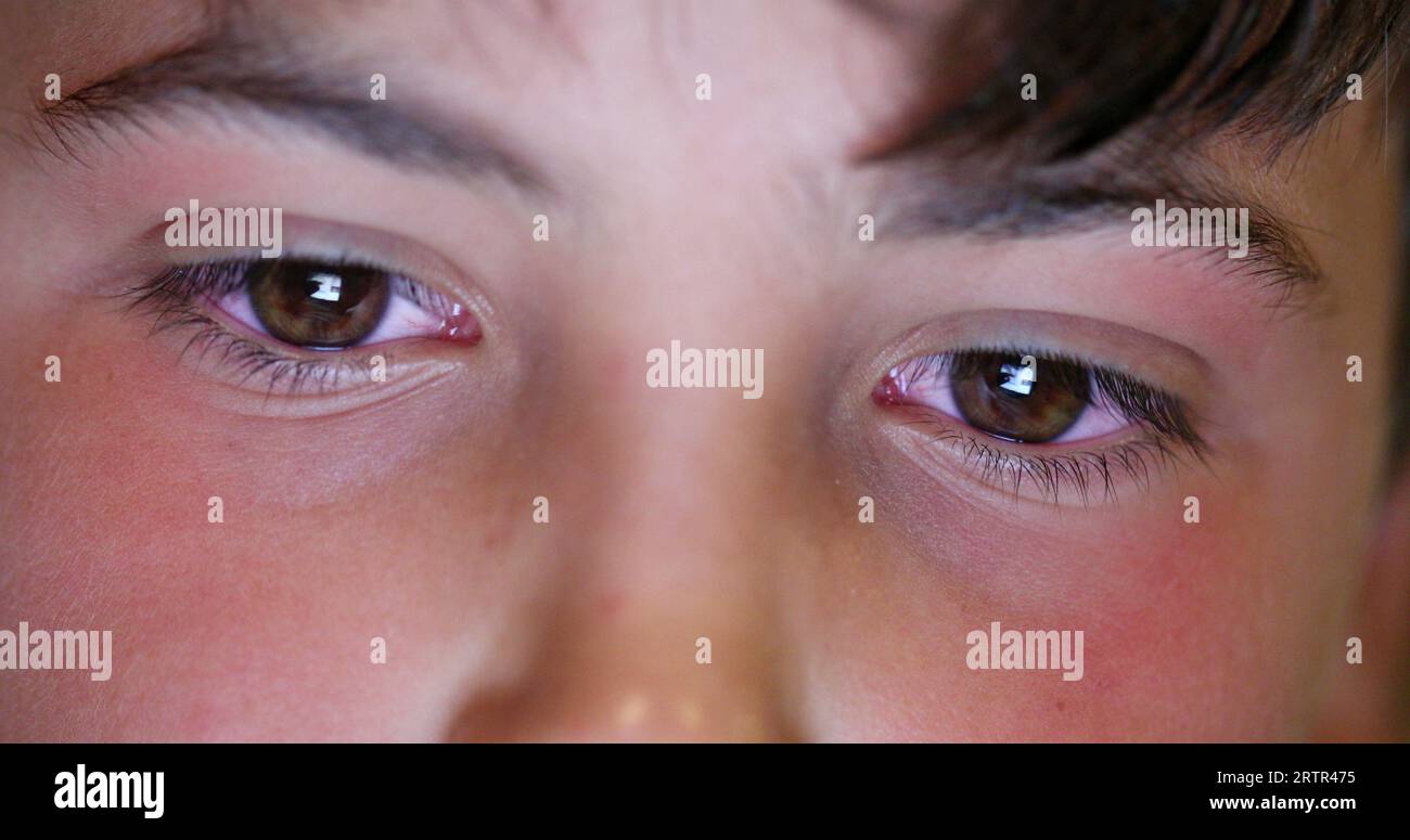 Child boy eyes looking at tablet device screen. Kid staring at blue ...