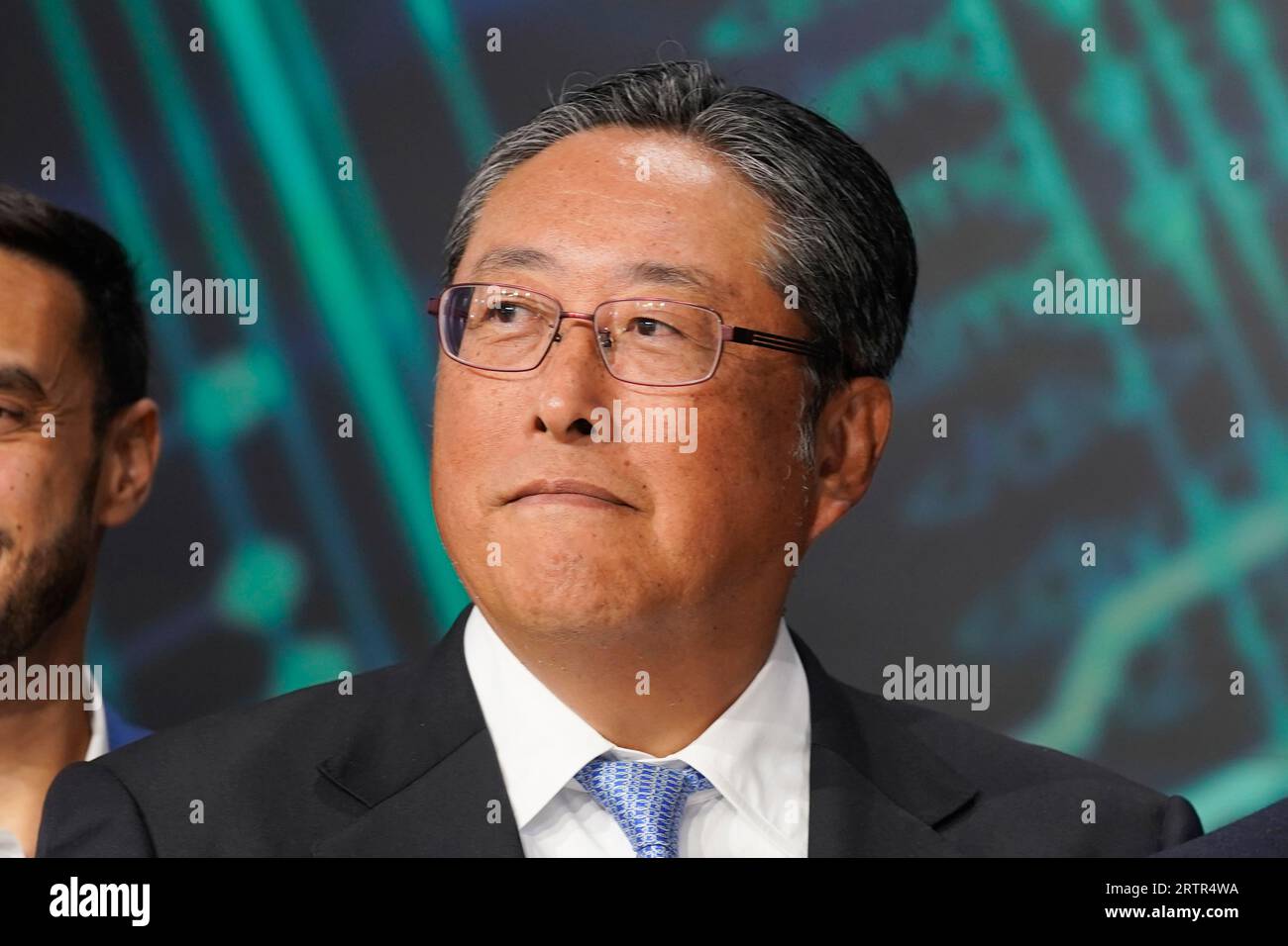 Softbank CFO Yoshimitsu Goto poses for photos at the Nasdaq MarketSite ...