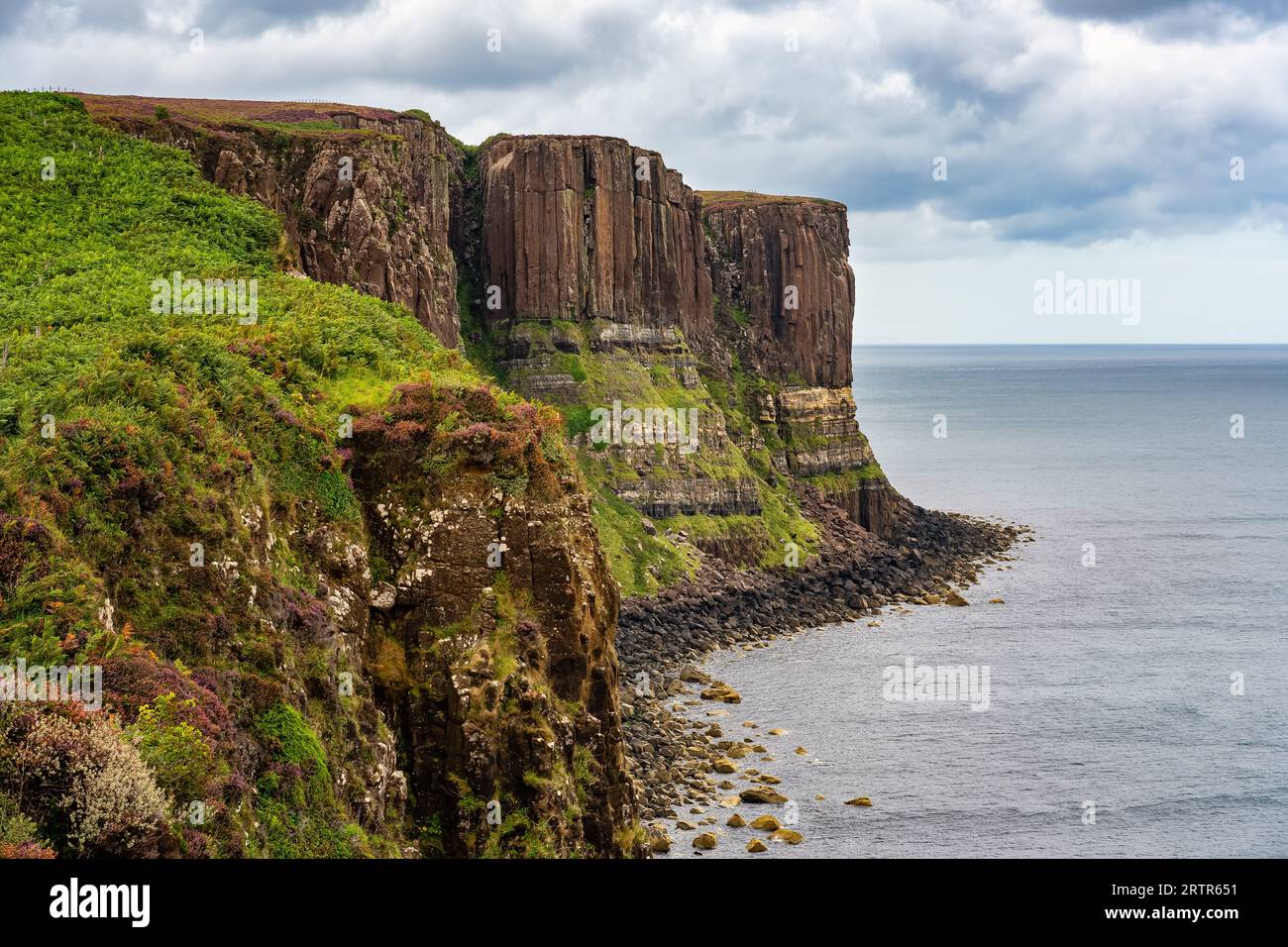 Cliffs with waterfall that falls into the sea on the stunning Isle of ...