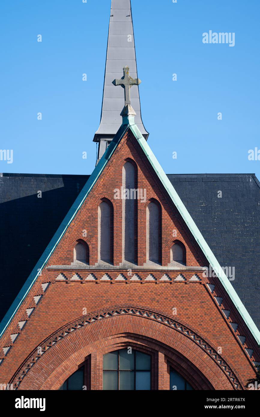 Tower and facade of a brick church Stock Photo - Alamy