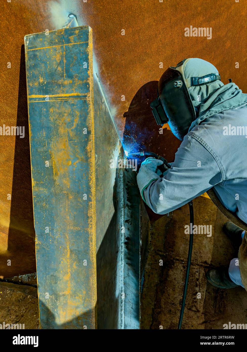 Welder working with an electrode. Welding work Stock Photo - Alamy