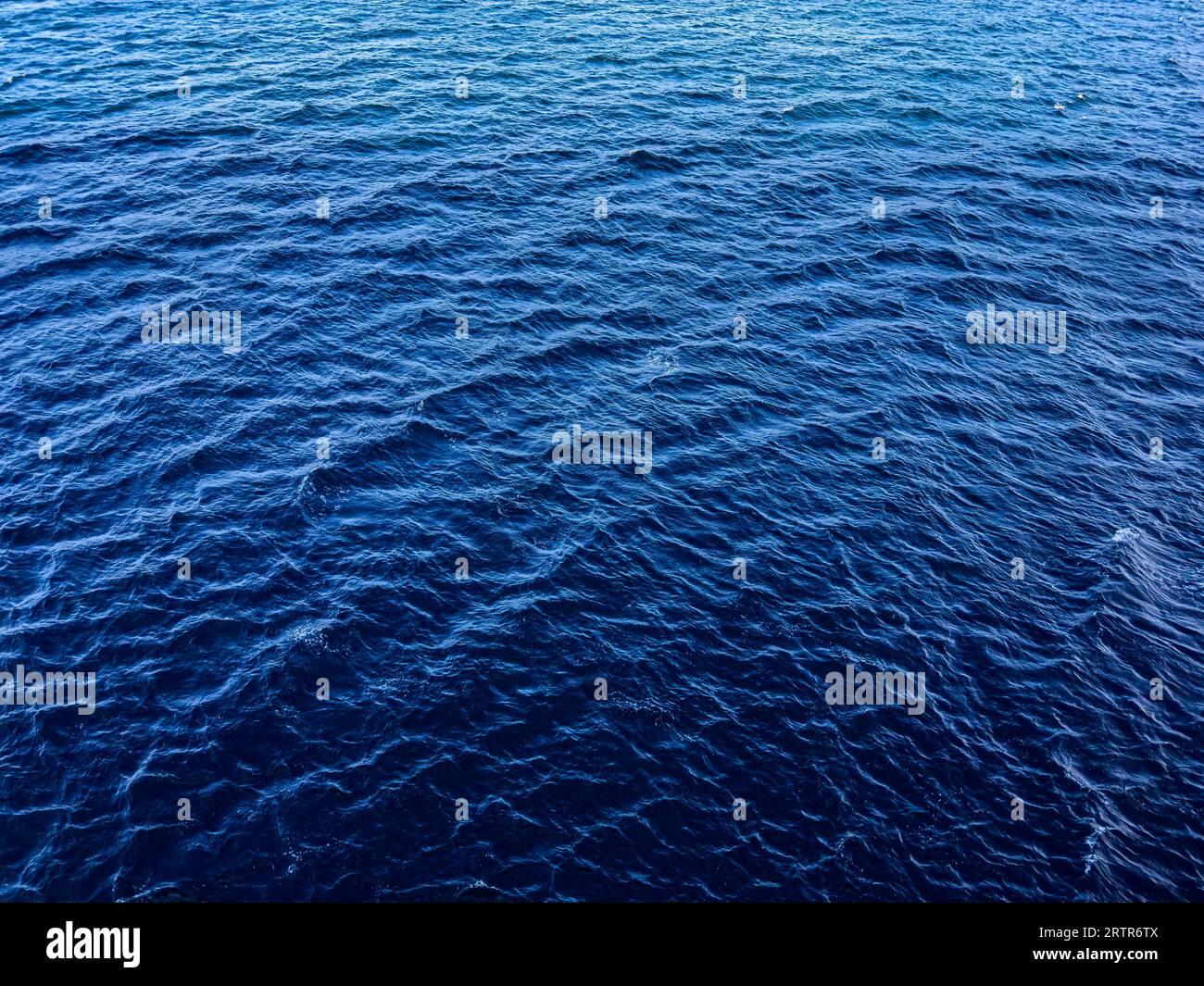 Blue water background. Wavy sea water surface Stock Photo - Alamy
