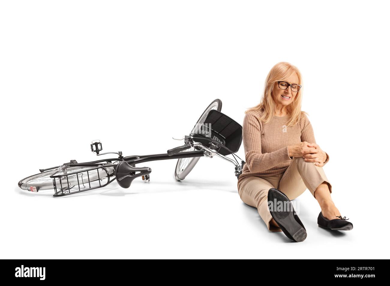 Woman falling from a bicycle isolated on white background Stock Photo ...