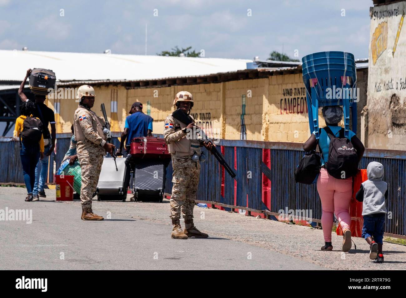 Dominican Republic security forces stand guard on a border bridge ...