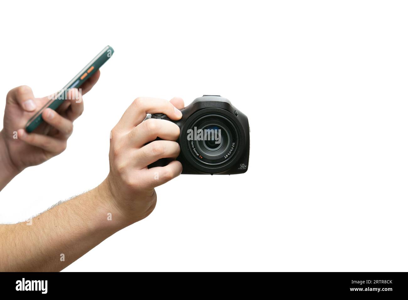 man holding camera and smartphone isolated on white background, camera ...
