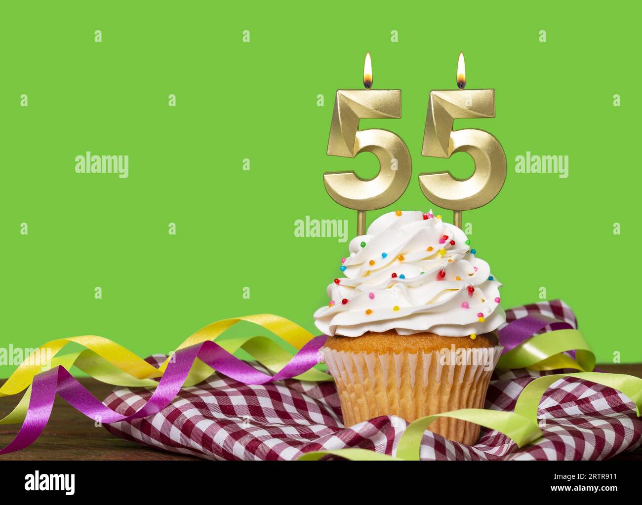 Birthday Cake With Candle Number 55 On Green Background Stock Photo birthday-cake-with-candle-number-55-on-green-background-stock-photo