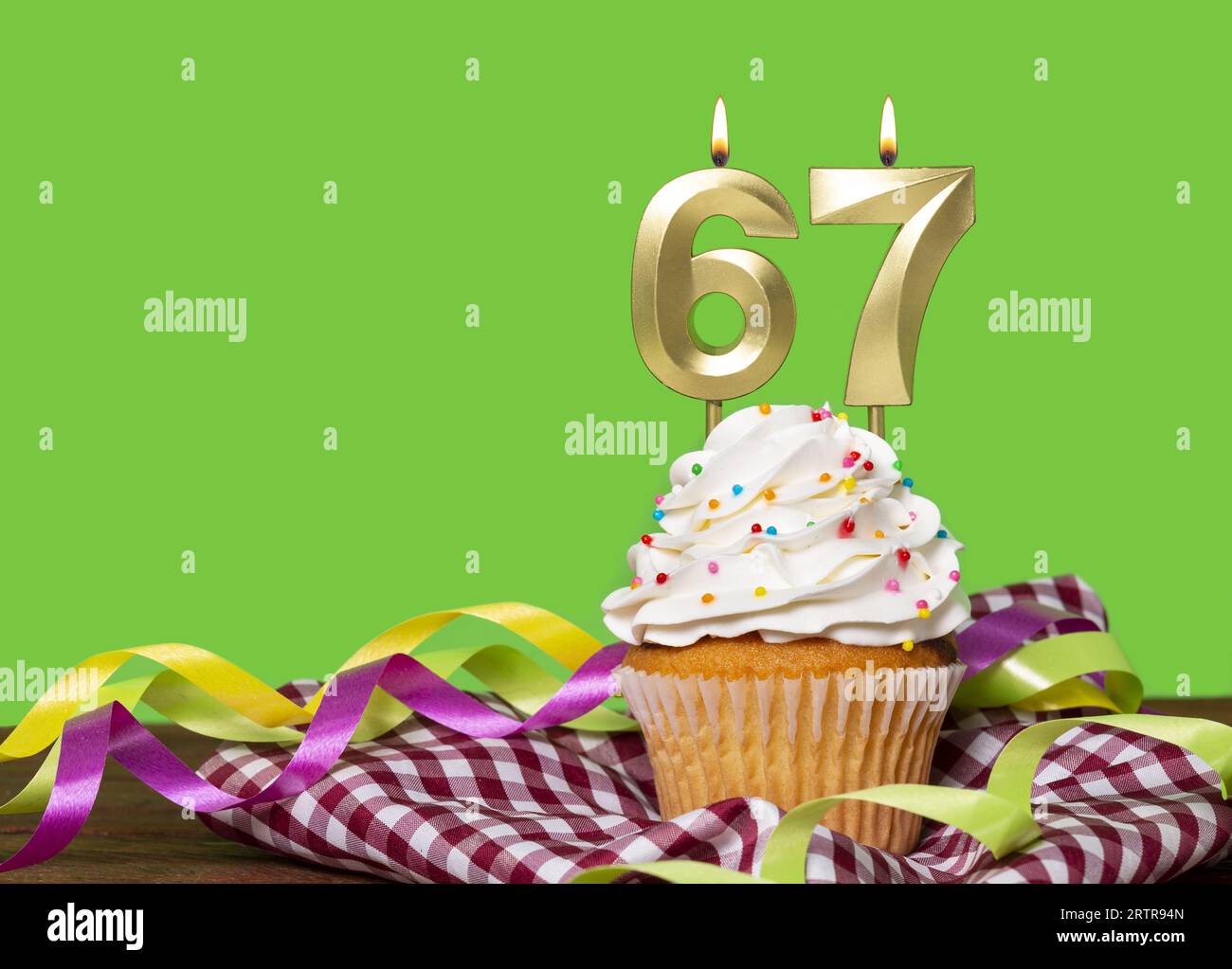 Birthday Cake With Candle Number 67 - On Green Background Stock Photo ...