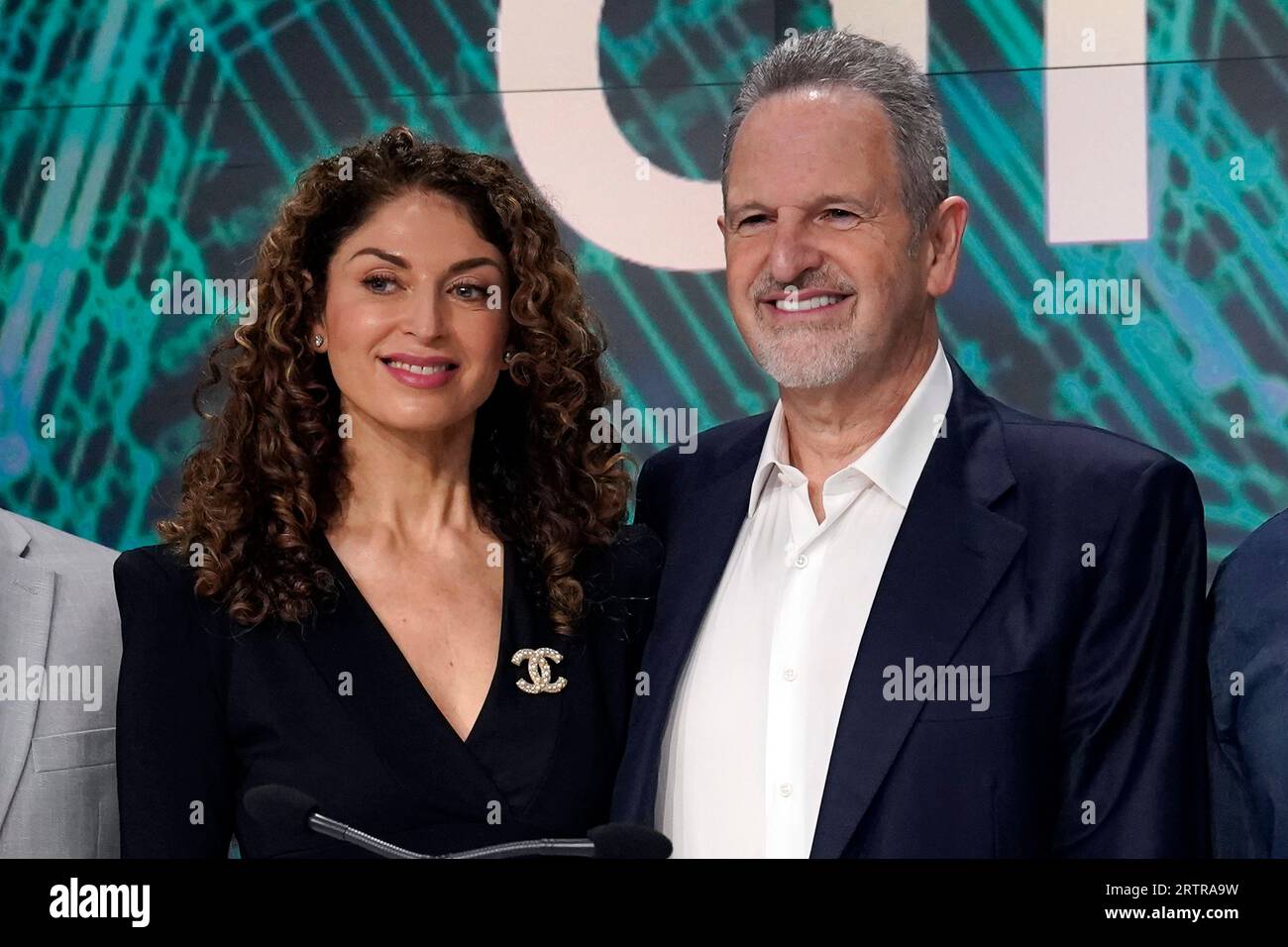 ARM Holdings CEO Rene Haas, right, poses for a photo with his partner ...