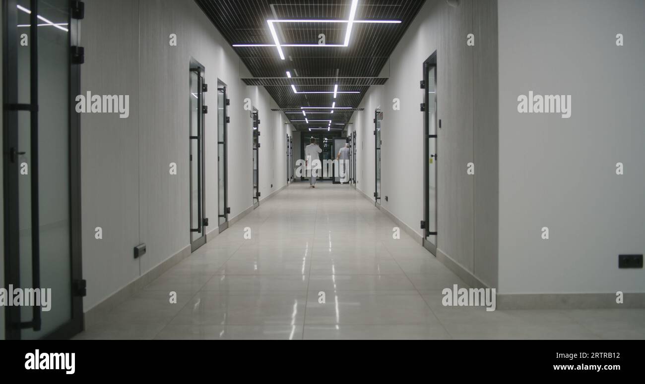 Nurse walking corridor back hi-res stock photography and images - Alamy