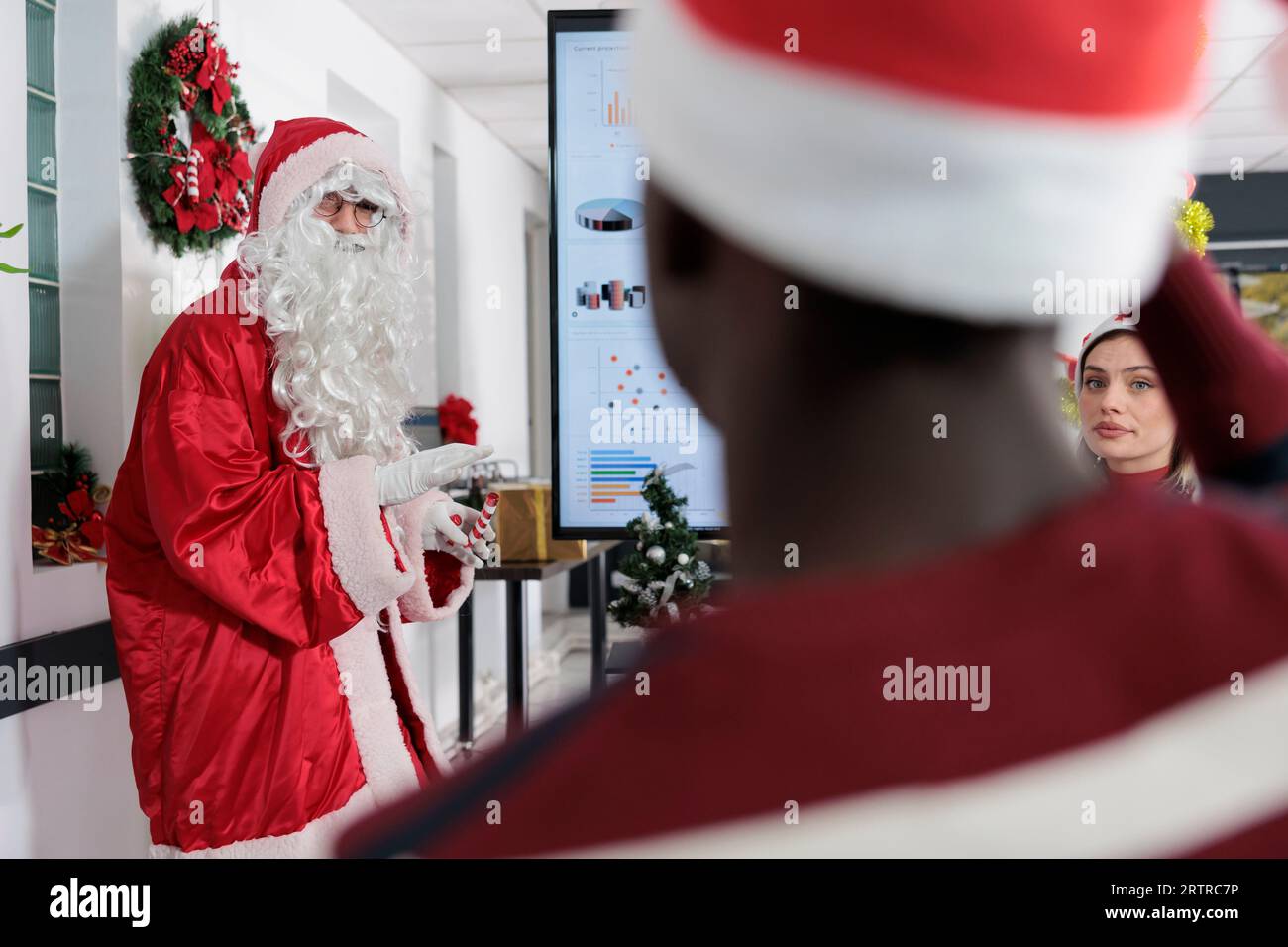Public speaker dressed as Santa Claus inspiring employees to advance ...