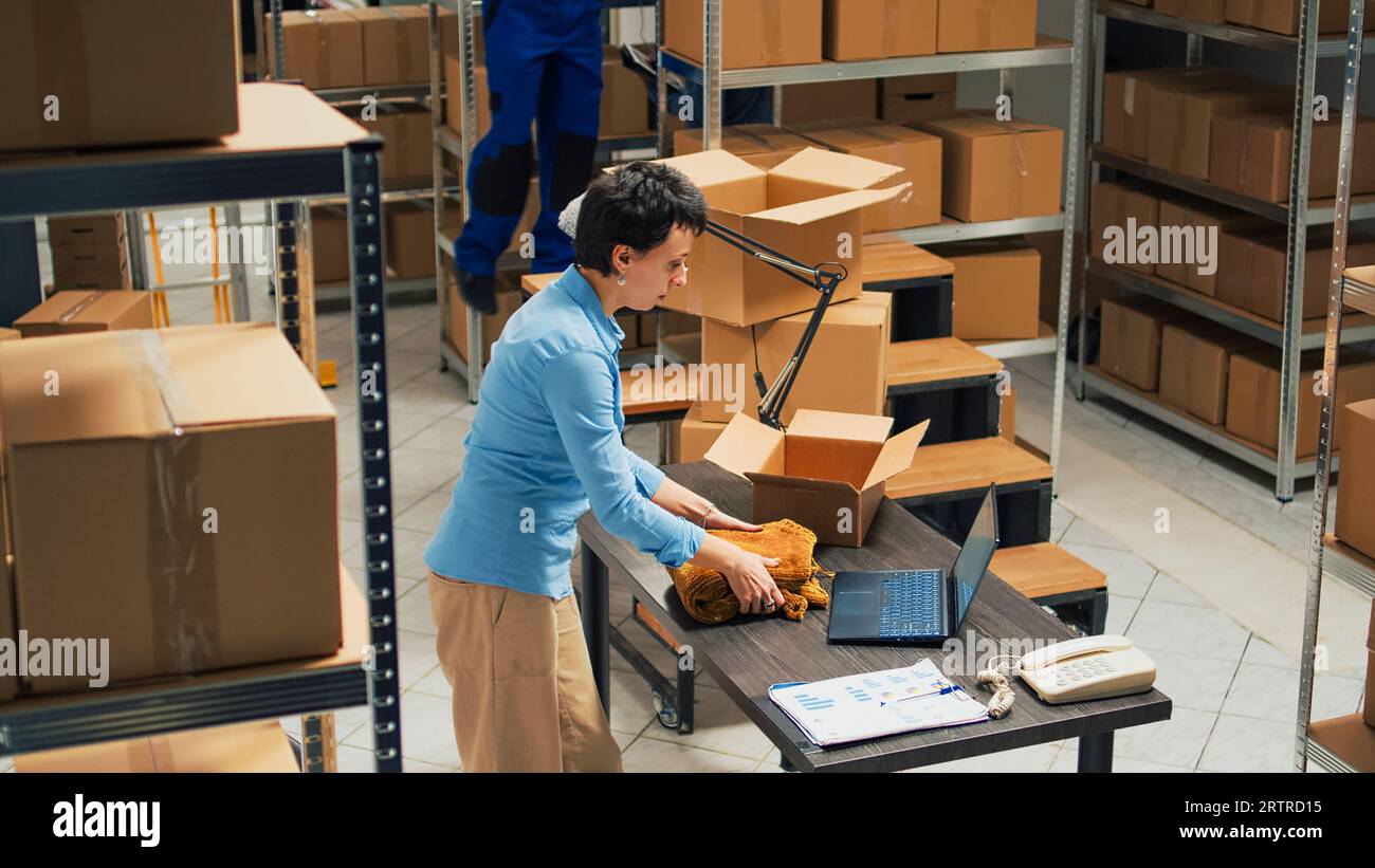 Woman employee taking supplies from hi-res stock photography and images ...