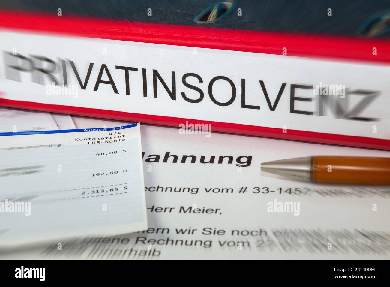 Symbol image of private insolvency: Folder, bank statement and a ...