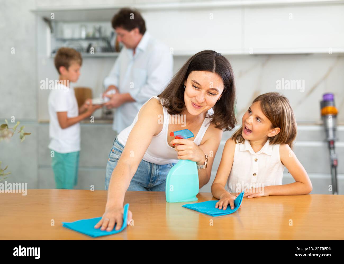 Cleaning together mother vacuuming hi-res stock photography and images ...