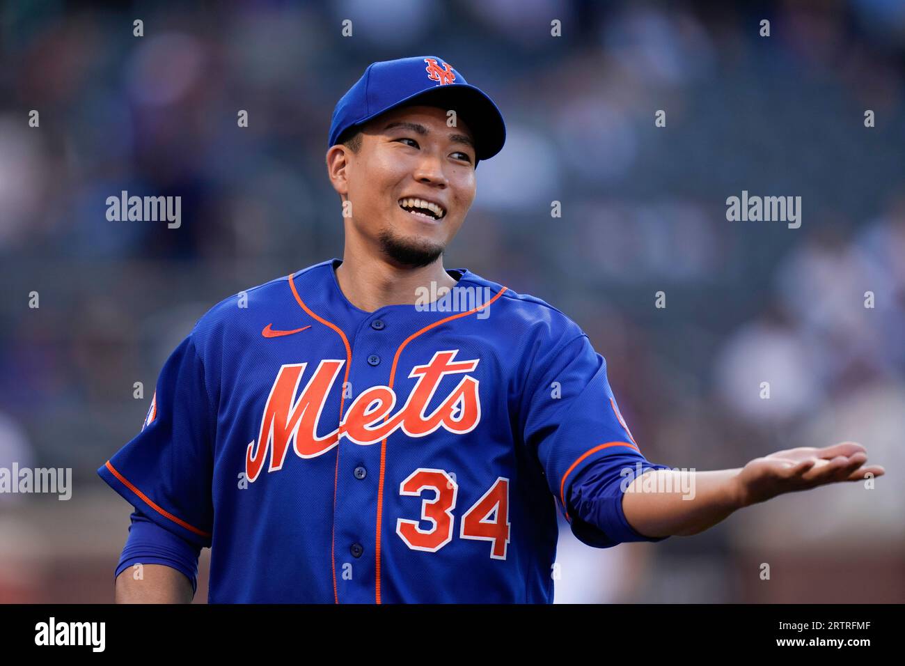 New York Mets starting pitcher Kodai Senga talks to teammates during ...