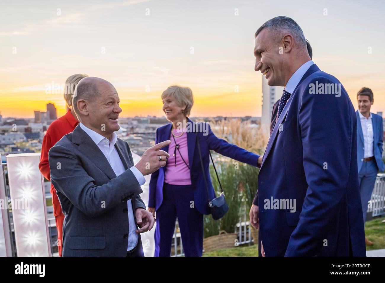 German Chancellor Olaf Scholz, left, talks with Vitali Klitschko, right ...