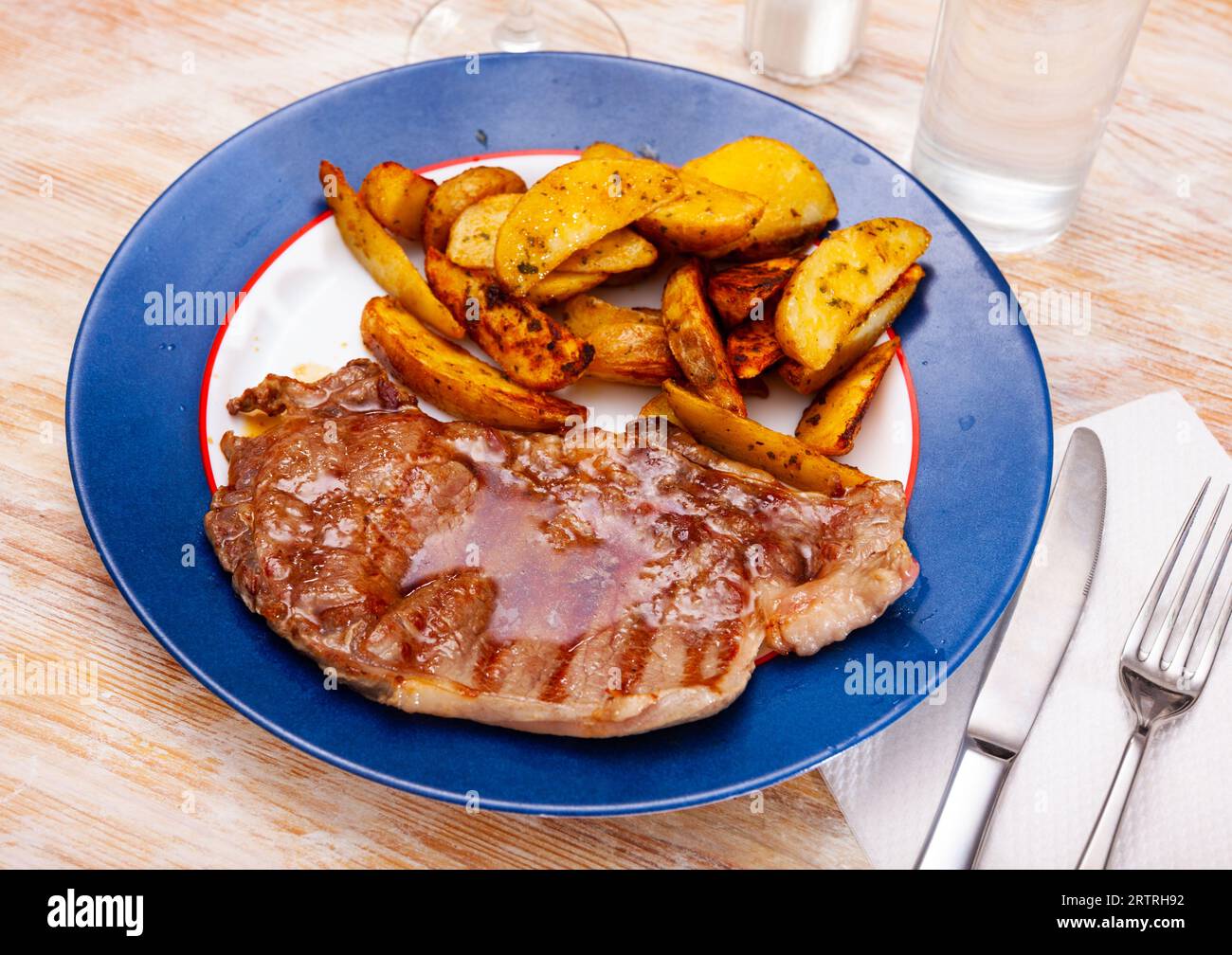 Juicy beef entrecote with baked potato Stock Photo - Alamy