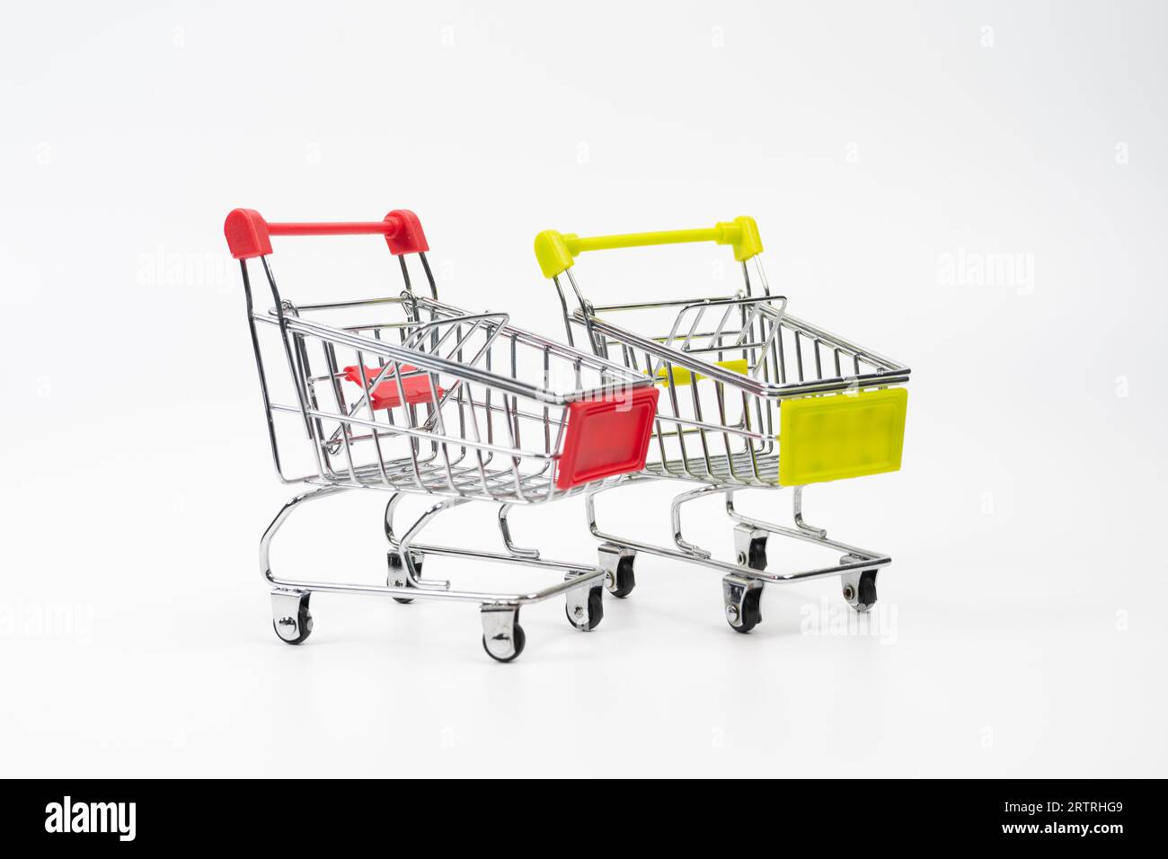 Two empty shopping carts isolated on white background Stock Photo - Alamy