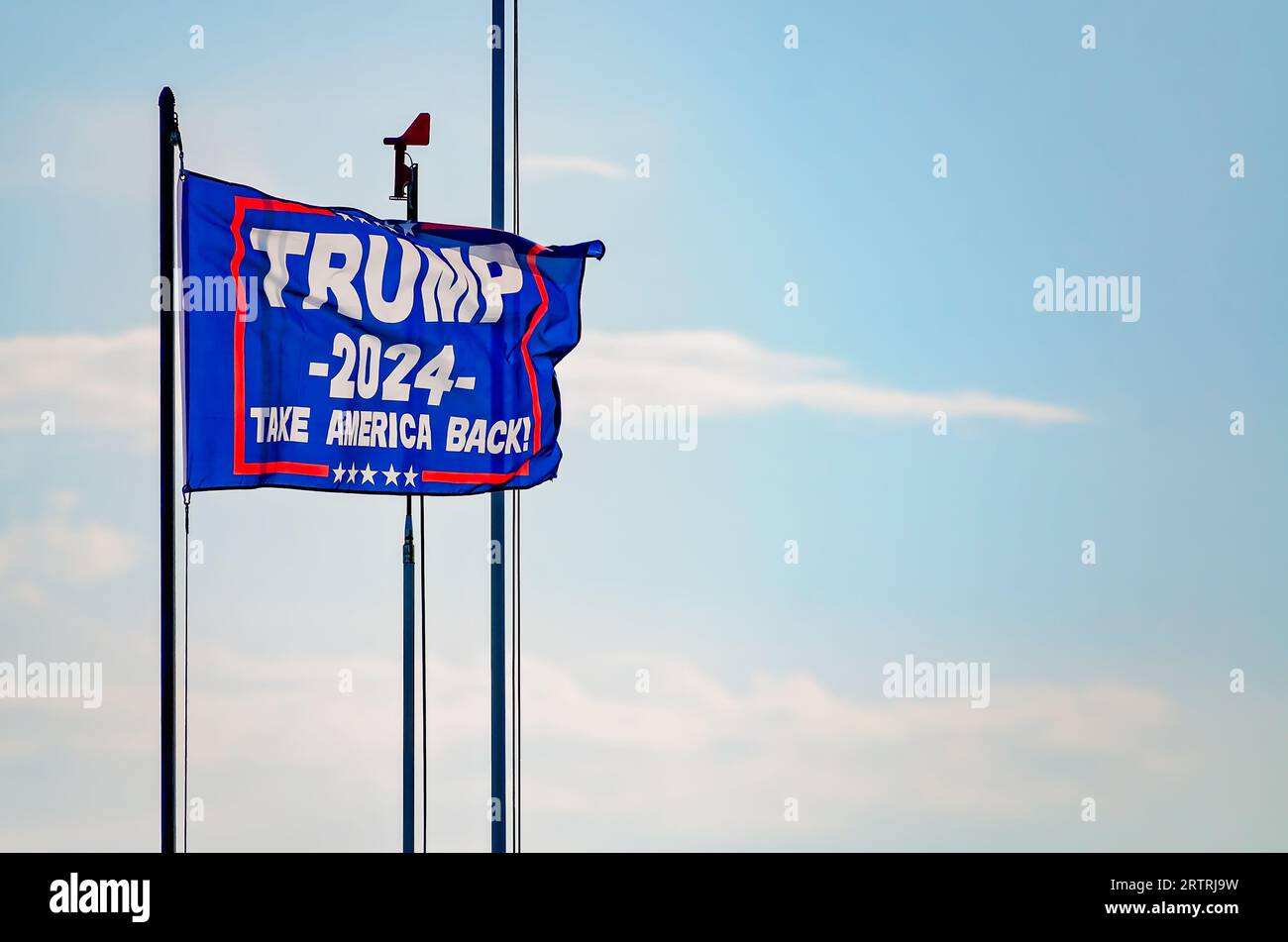 A Trump 2024 flag flies at a pier on Coden Beach, Sept. 11, 2023, in ...