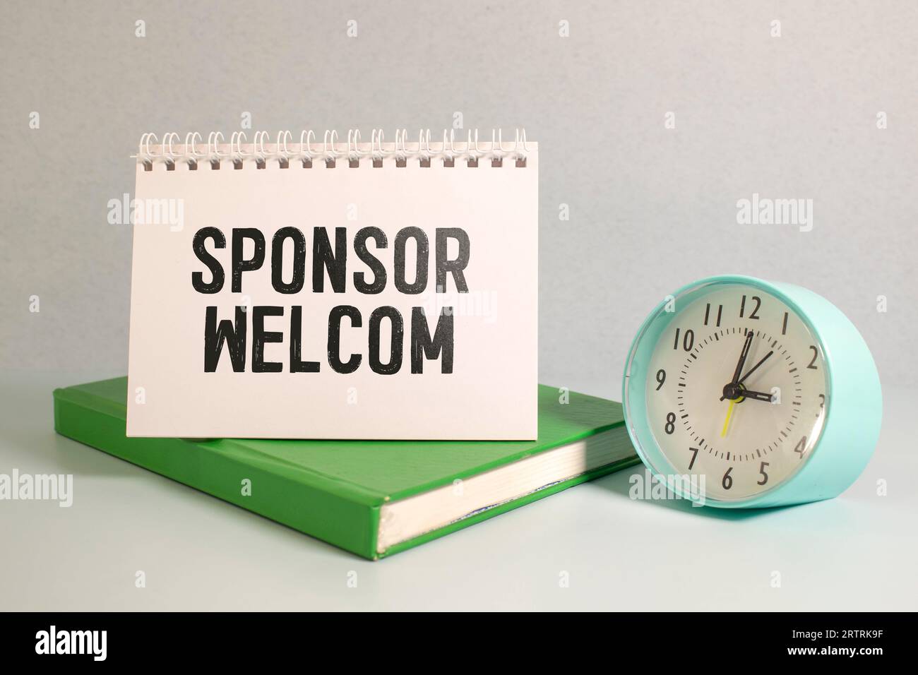 Yellow sticker on the dark gray texture background with text Sponsors ...