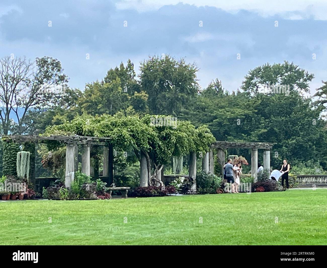Tourists visit Wave Hill‘s main Pergola. on the Great Lawn . Grounds at ...