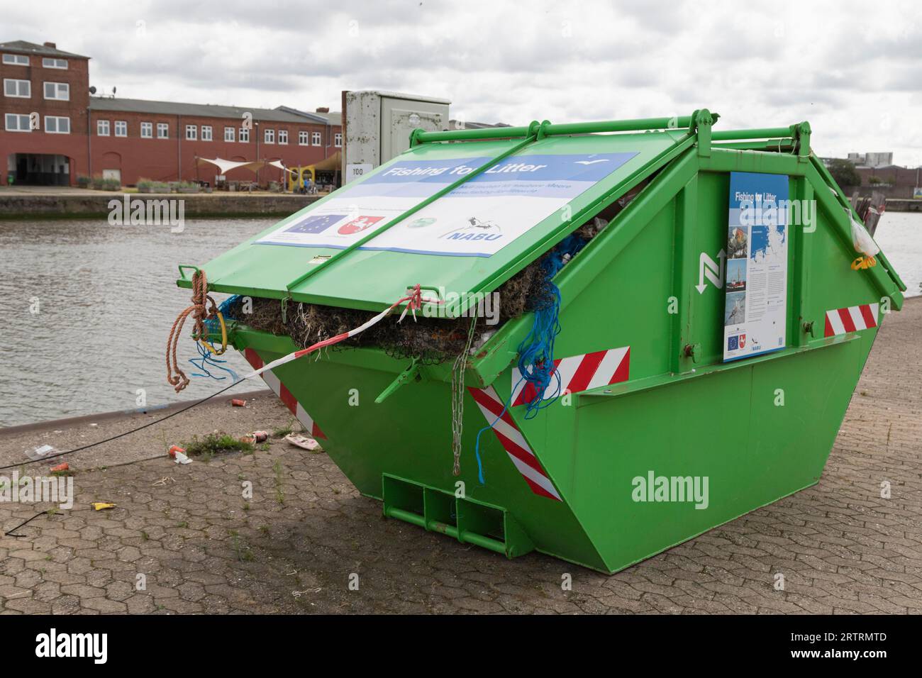 Symbolic image nature conservation, waste container for old fishing ...