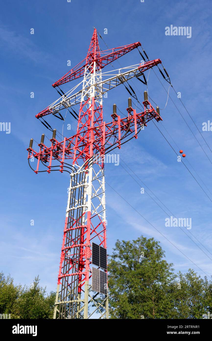 High-voltage pylon, red-white, power lines, overhead lines, solar ...