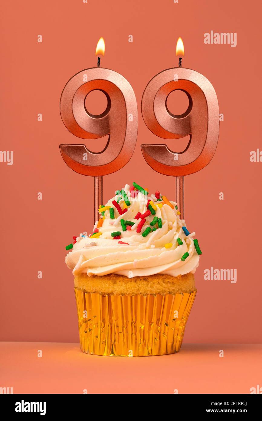 Birthday cake with candle number 99 - Coral fusion background Stock ...