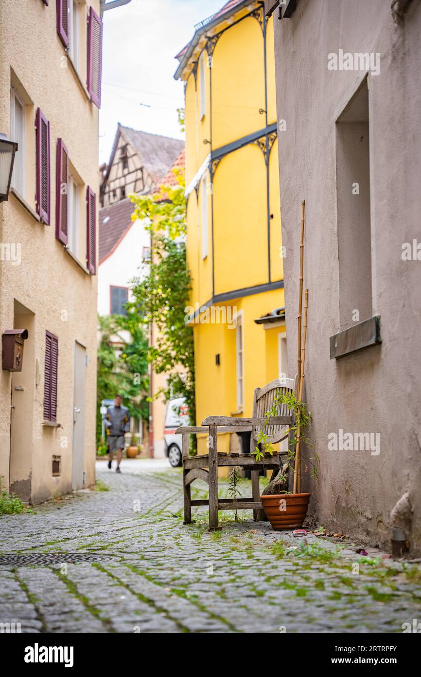 Narrow alleyway alley with wooden bench, Rottenburg am Neckar, Germany ...