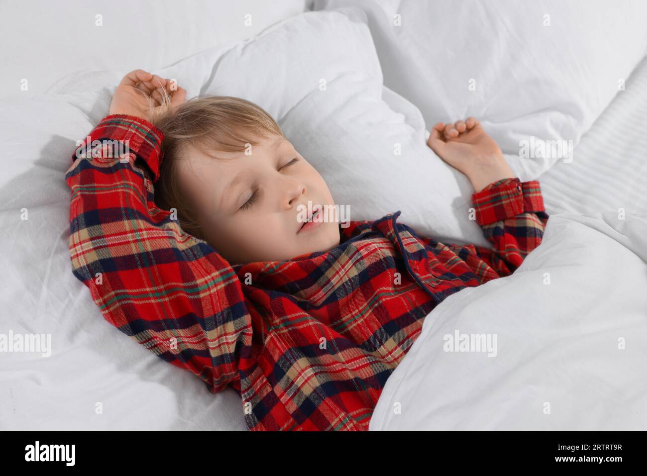 Little boy snoring while sleeping in bed Stock Photo - Alamy