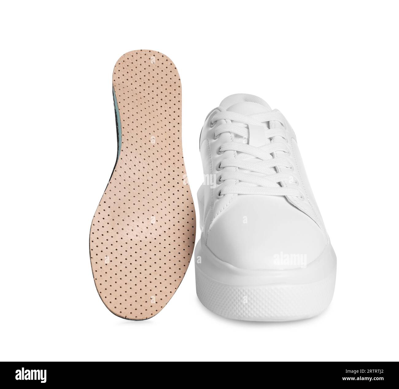 Orthopedic insole near shoe on white background Stock Photo - Alamy