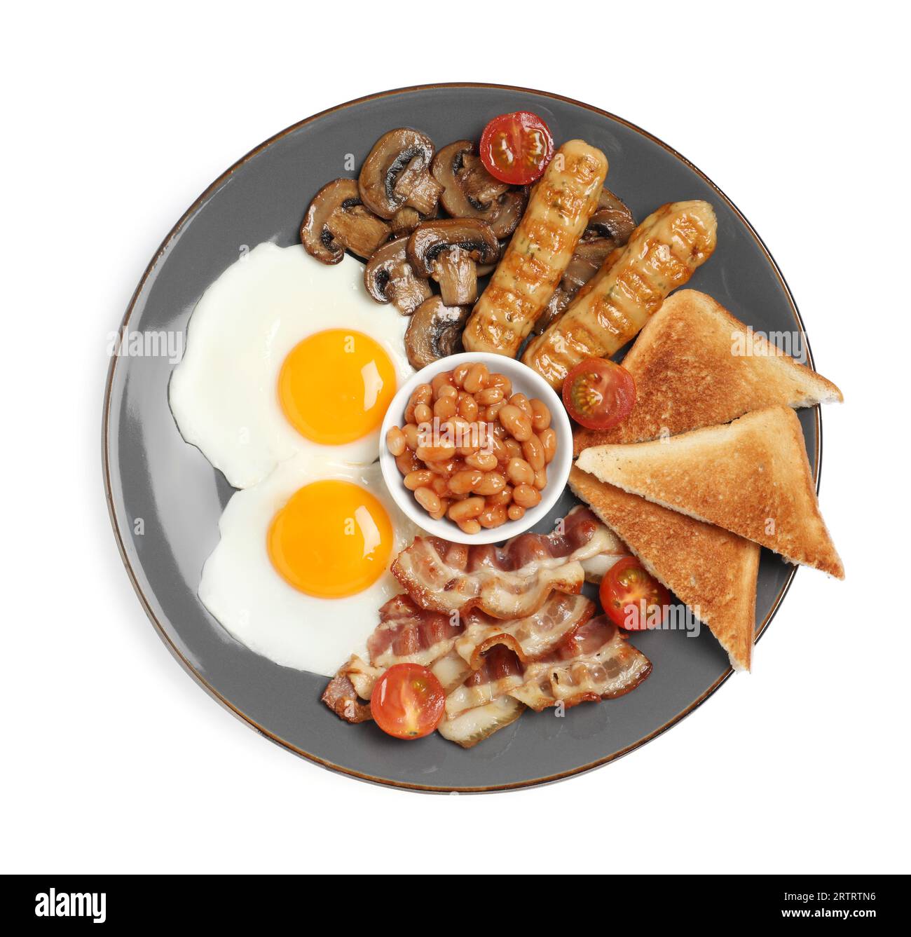 Plate of cooked traditional English breakfast isolated on white, top ...
