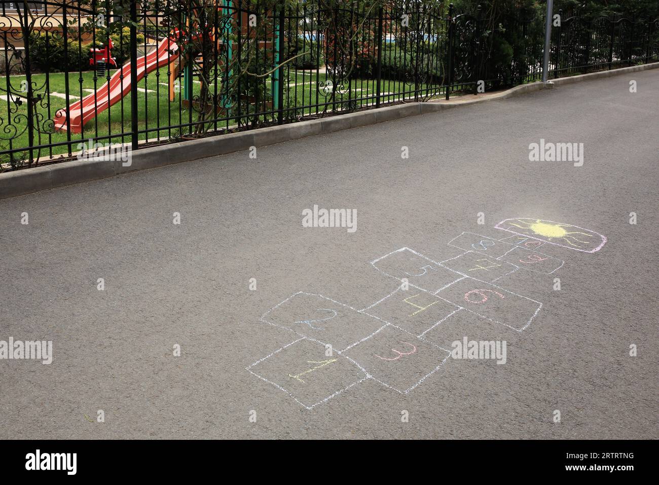 Hopscotch drawn with colorful chalk on asphalt outdoors Stock Photo - Alamy