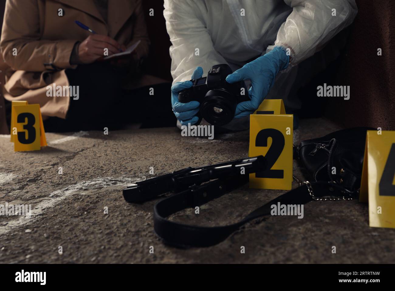 Investigator and criminologist working at crime scene outdoors, closeup Stock Photo - Alamy