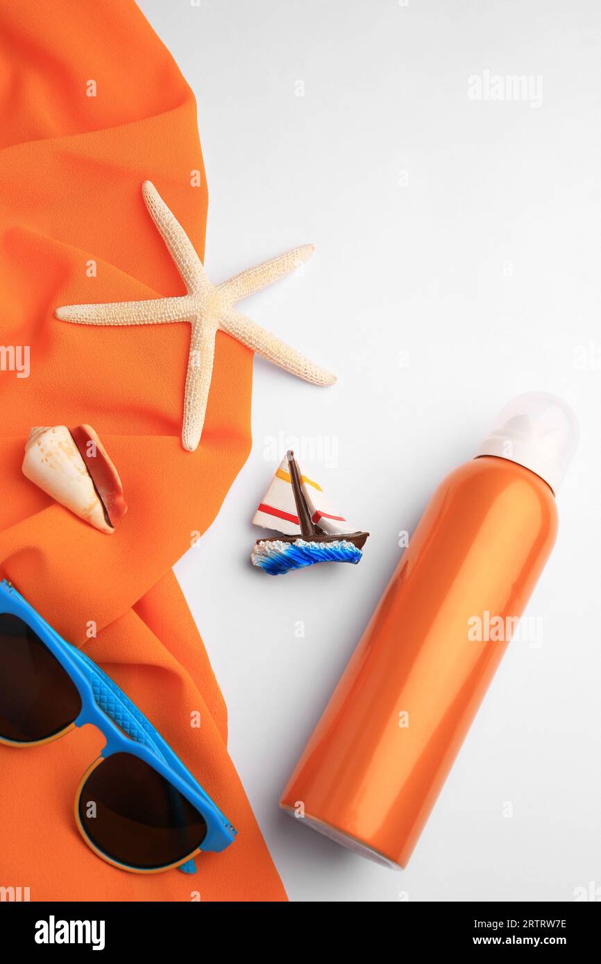 Flat lay composition with bottle of sunscreen on white background Stock ...
