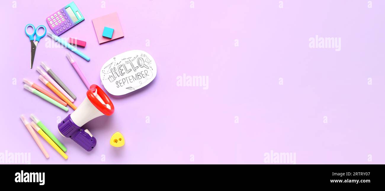 Stationery, megaphone and paper sheet with text HELLO SEPTEMBER on ...
