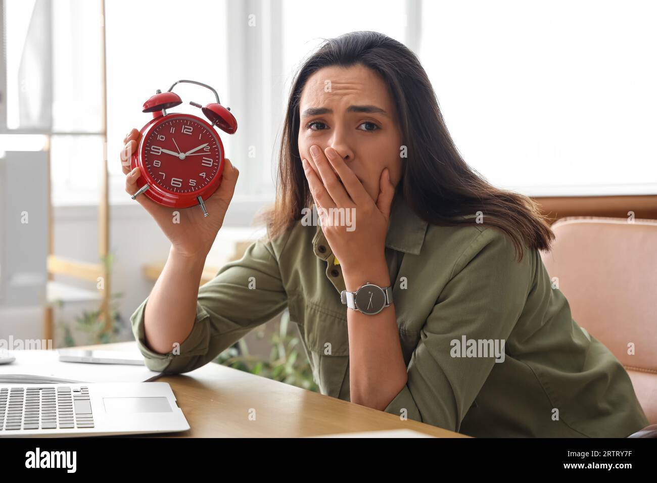 Stressed young businesswoman working under deadline in office Stock ...