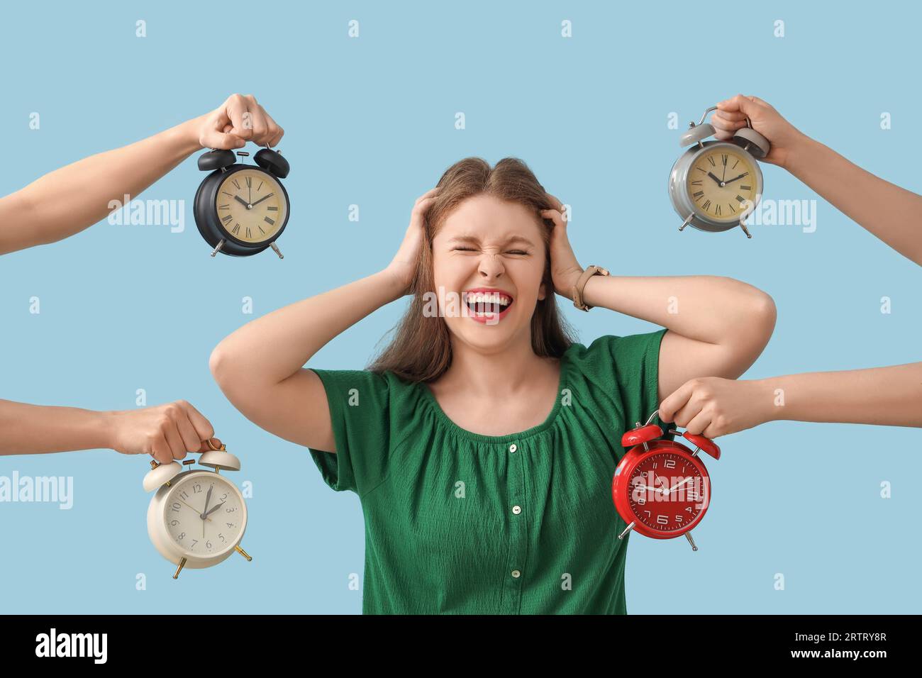 Stressed young woman and female hands with clocks on blue background ...