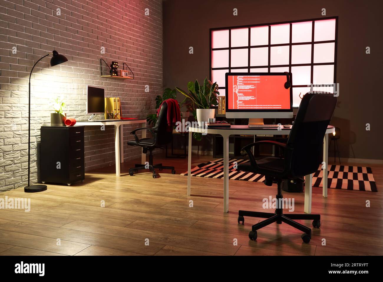Interior of dark office with programmer's workplaces Stock Photo - Alamy