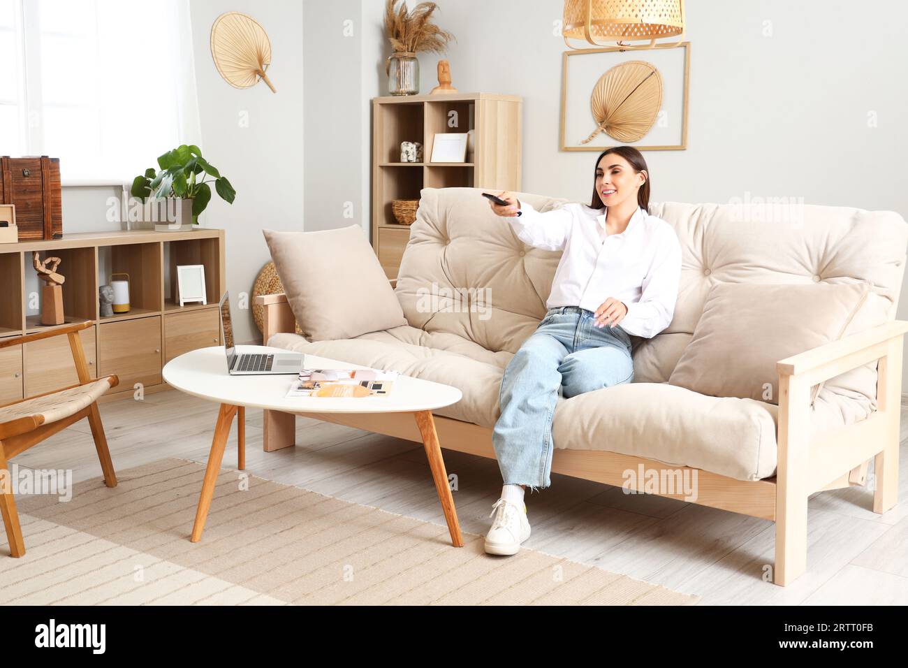 Watching tv on couch hi-res stock photography and images - Alamy