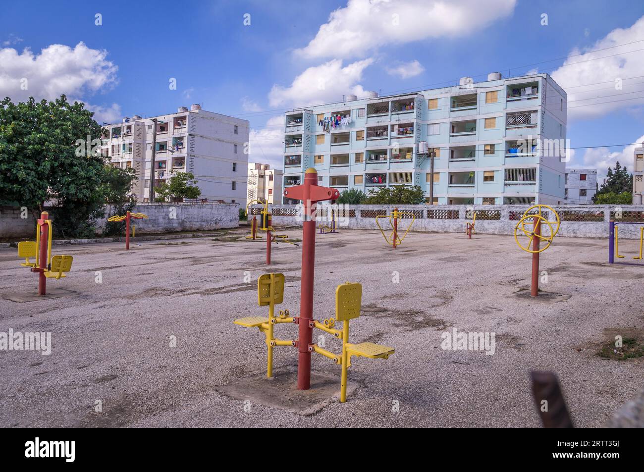 The real Cuba: Emty playground and apartment blocks in residential area ...