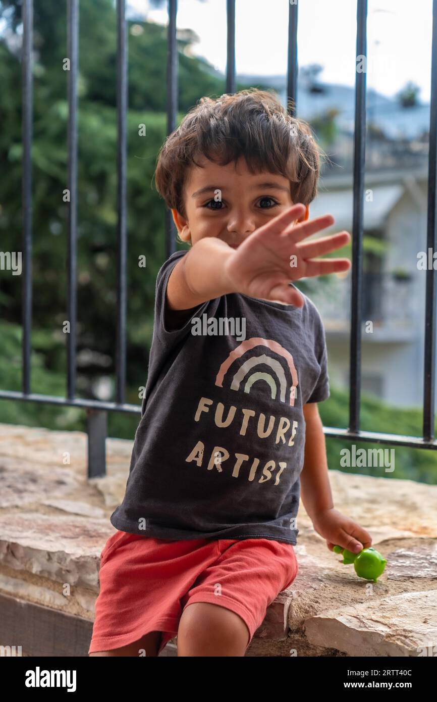 Boy waving hi-res stock photography and images - Alamy