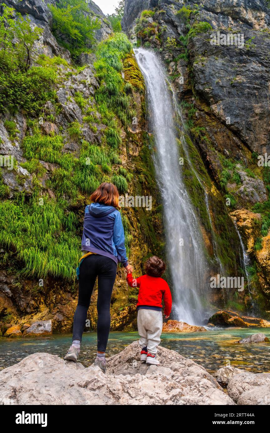 Mother with her son Grunas waterfall of Theth national park in summer ...