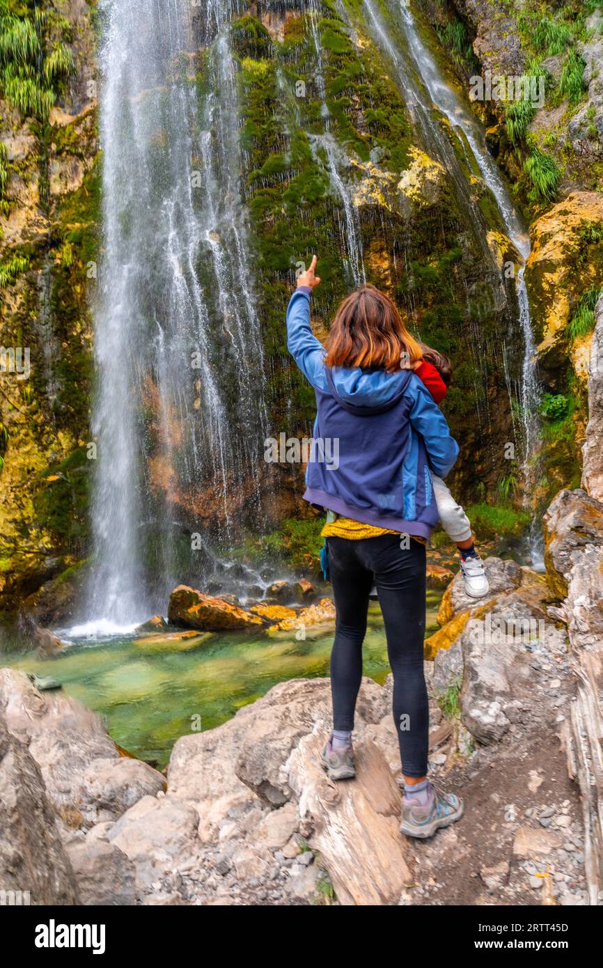 Mother with her son Grunas waterfall in Theth national park, Albania ...