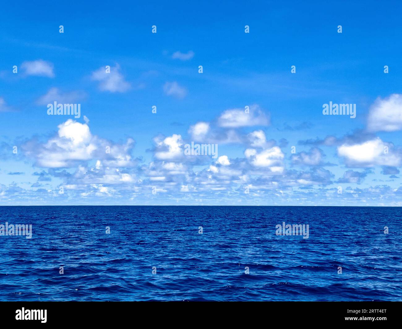 Clouds Altocumulus reflected in front of blue sky on horizon over ...